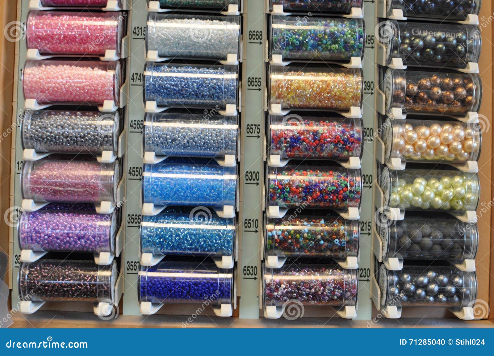 Colored pearls in tubes stock photo. Image of square - 71285040