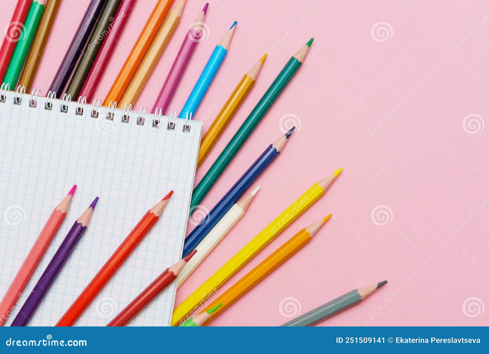 Colored Pencils for Drawing and a Notebook in a Cage on a Pink ...