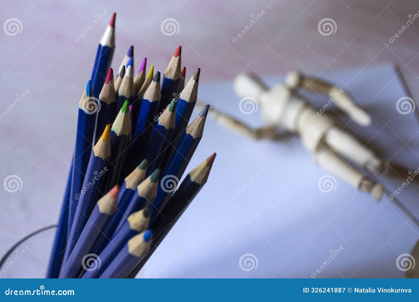 Colored Pencils, Empty Paper and Dummy for Sketching on the Table ...