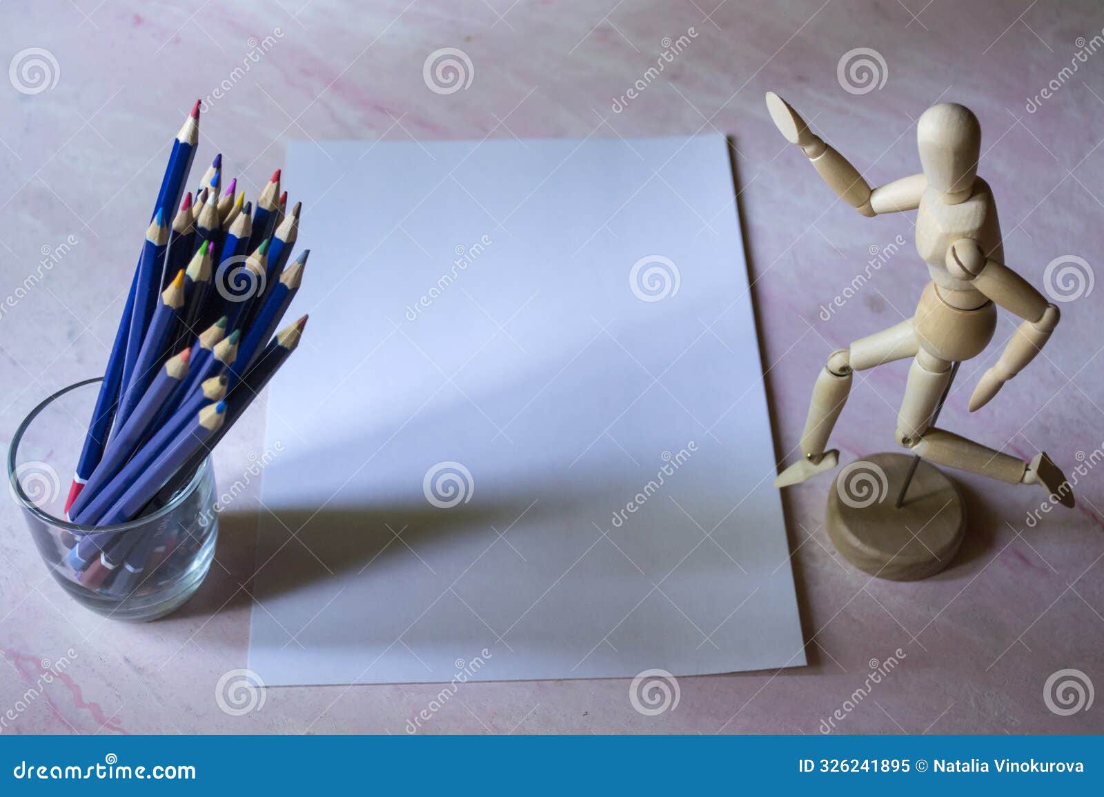 Colored Pencils, Empty Paper and Dummy for Sketching on the Table ...