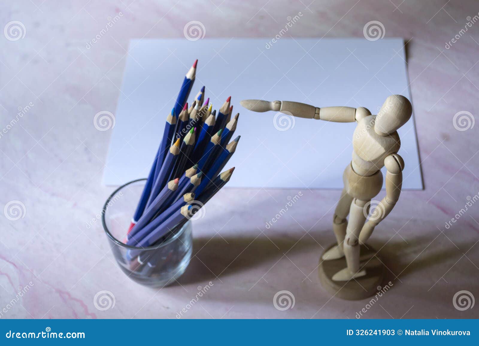 Colored Pencils, Empty Paper and Dummy for Sketching on the Table ...