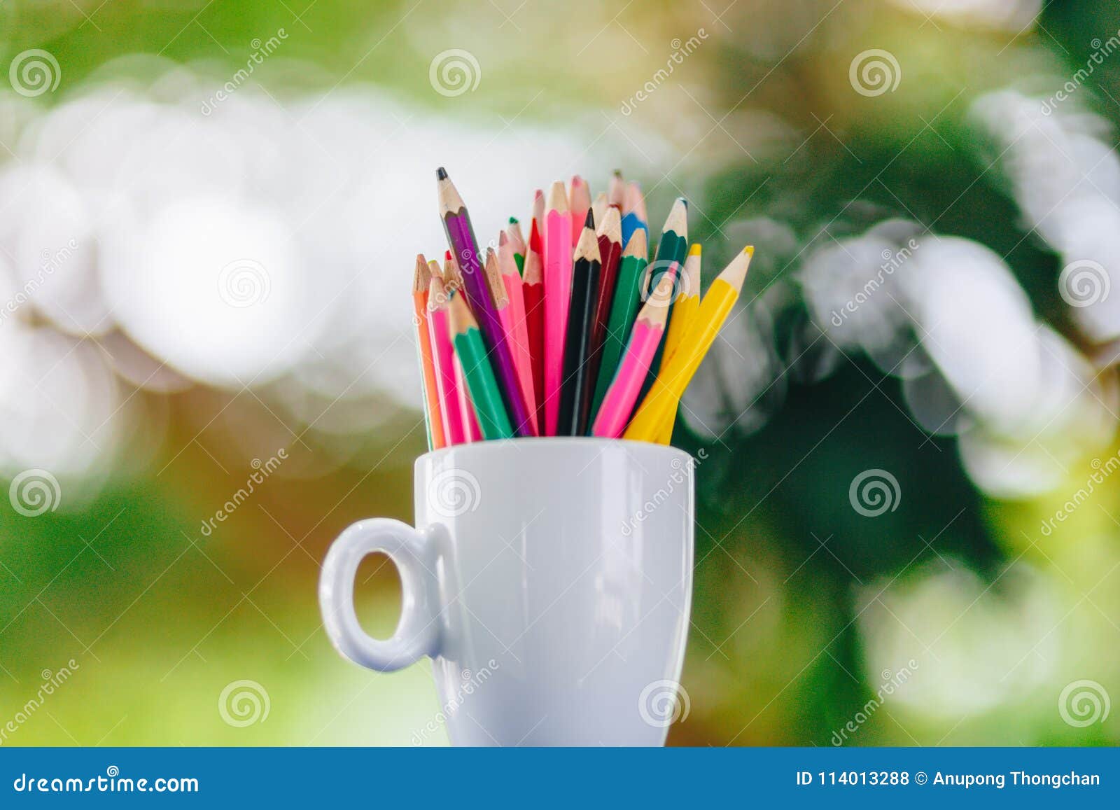 Colored Pencils in a Glass on Bokeh Background Stock Photo - Image of ...