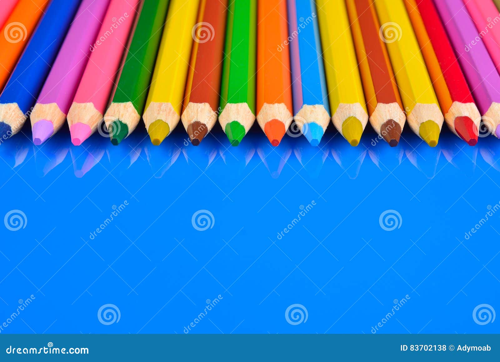 Colored Pencils Isolated on Blue Background with Reflection Stock Photo ...