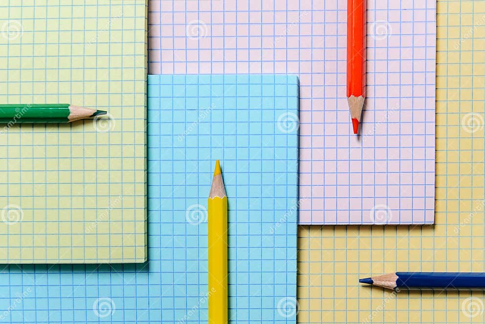 Colored Pencils Lie on the Background of Multi-colored Notebook Sheets ...