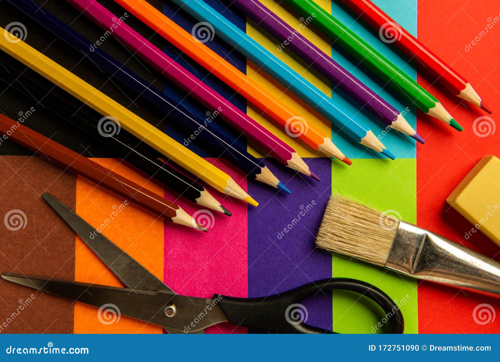 Colored Pencils, Scissors, Brush and Eraser Lie on Colored Paper Stock ...