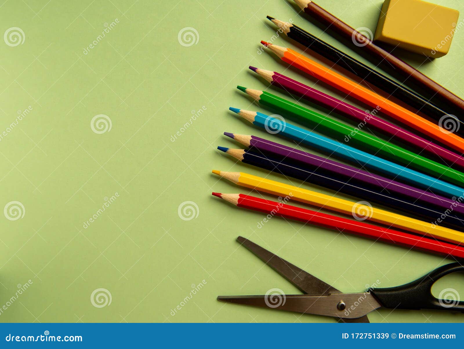 Colored Pencils, Scissors and Eraser Lie on Colored Paper Stock Image ...