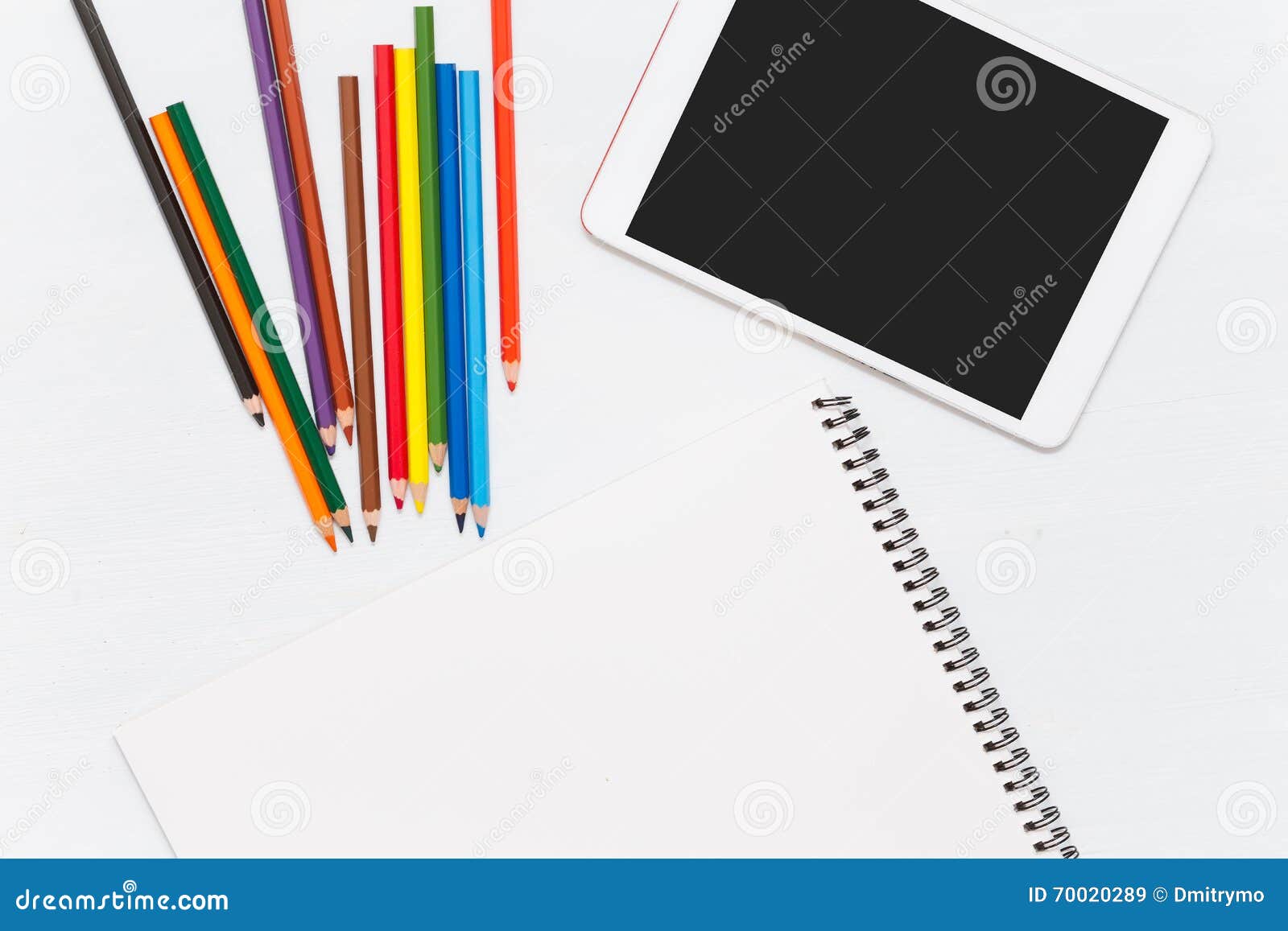 Colored Pencils on Wood Table. Blank Notebook and Tablet Stock Image ...