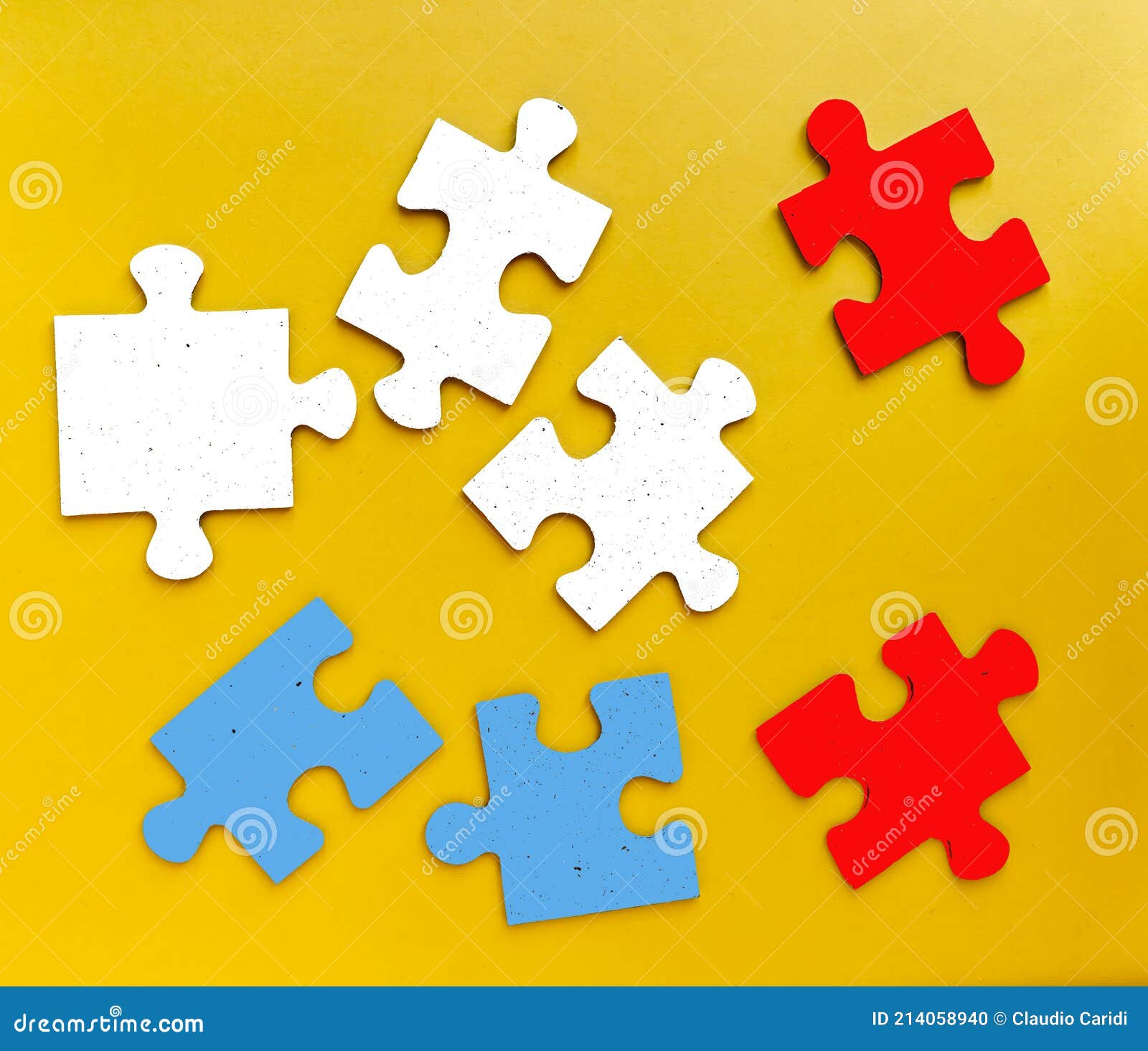 Colored Pieces of a Puzzle Game on Yellow Background. Studio Shot Stock ...