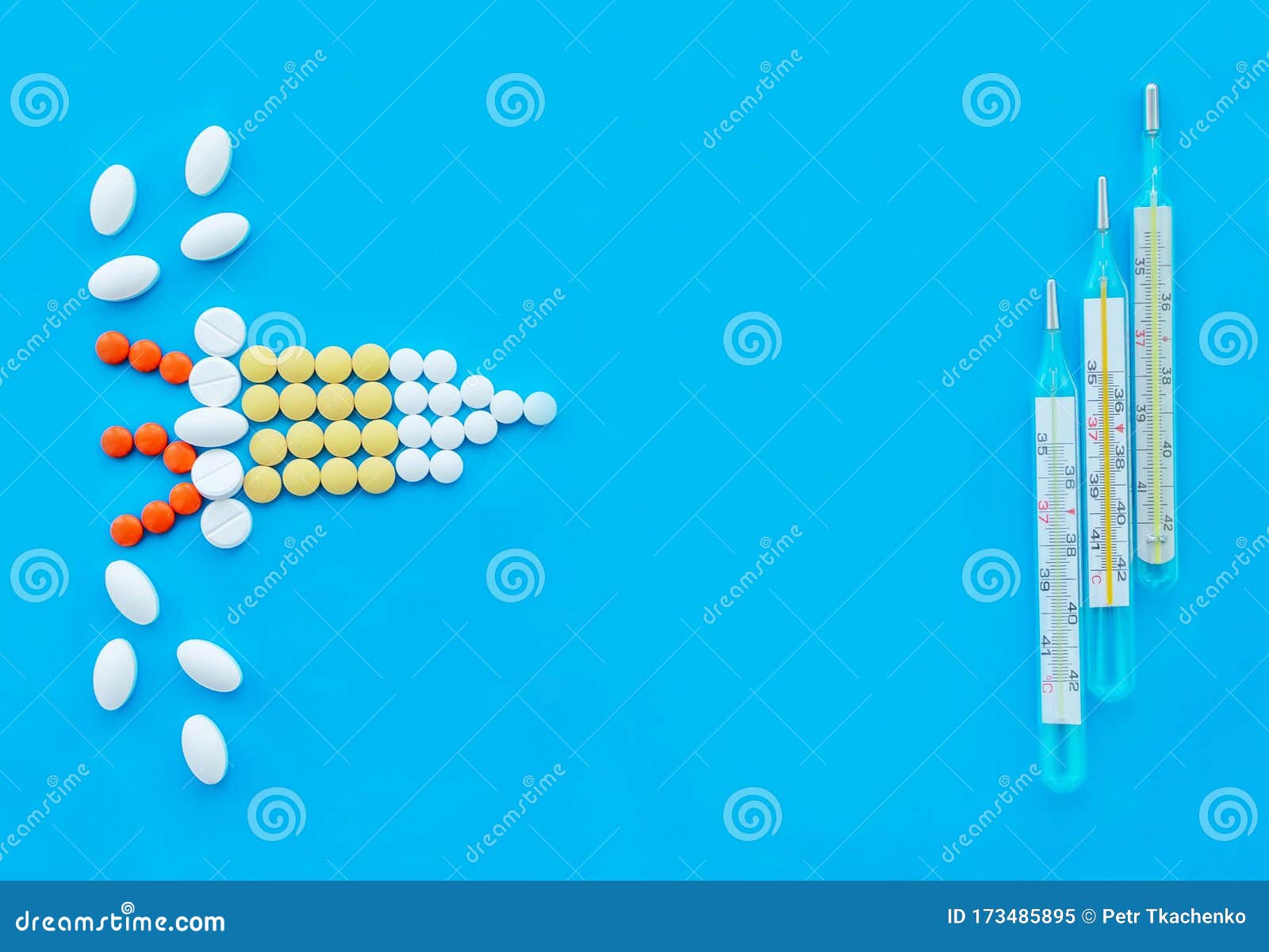 Colored Pill in the Form of a Rocket and the Thermometer on Blue ...