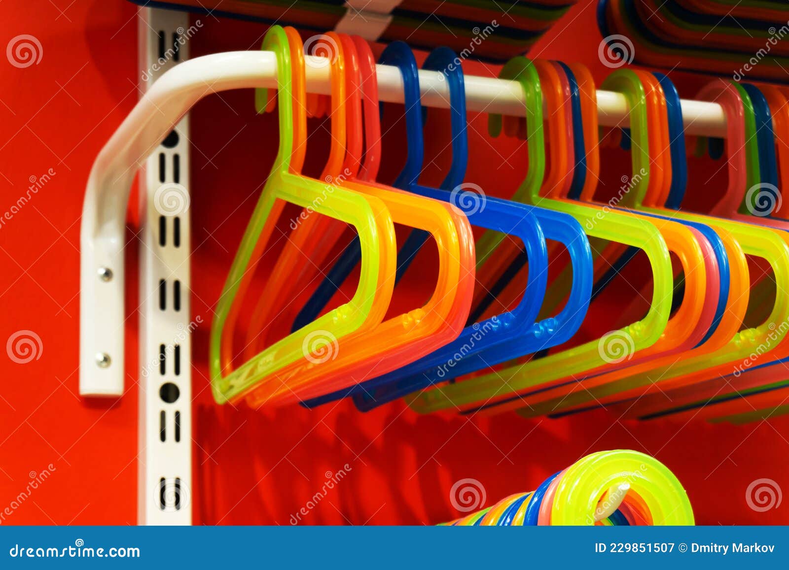 Colored, Plastic Clothes Hangers Hang in the Dressing Room Stock Image ...