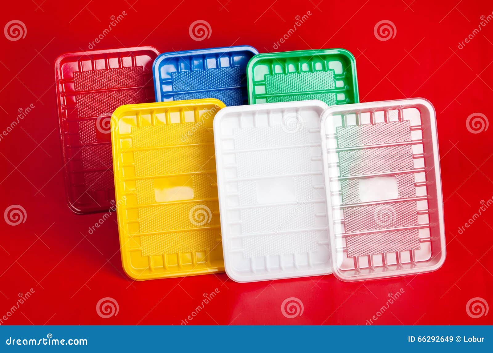 Colored Plastic Plates on Red Background Stock Image - Image of human ...