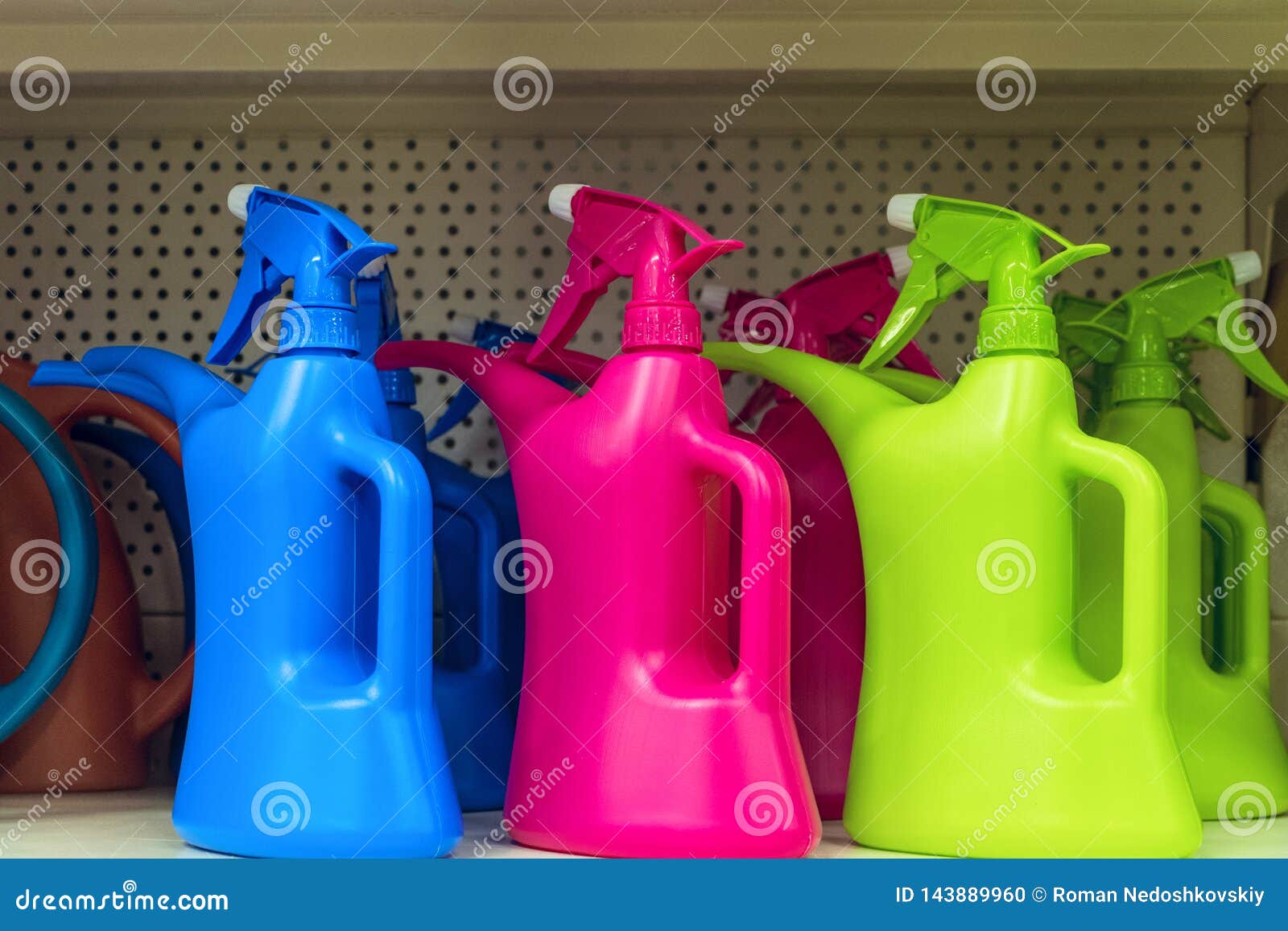 Colored Plastic Watering Spray Cans Stock Photo - Image of material ...