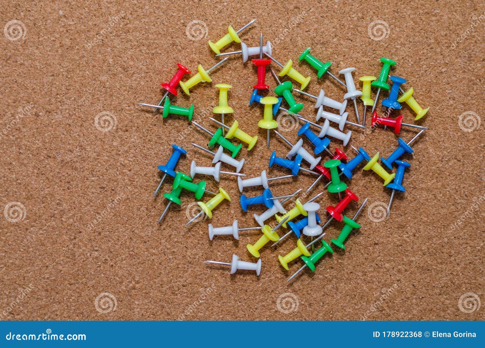 Colored Push Pins Lie on a Corkboard of Reminders. View from Above ...