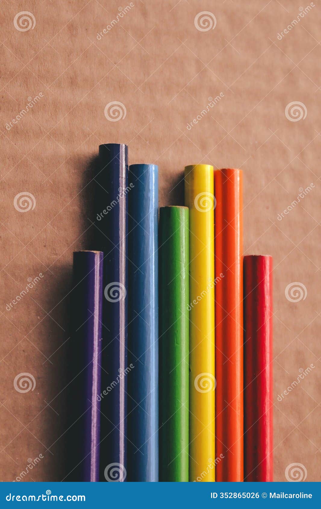 Colored Rainbow Columns of Pencils on a Brown Corrugated Box Surface ...