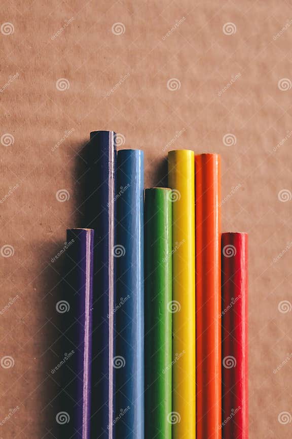 Colored Rainbow Columns of Pencils on a Brown Corrugated Box Surface ...