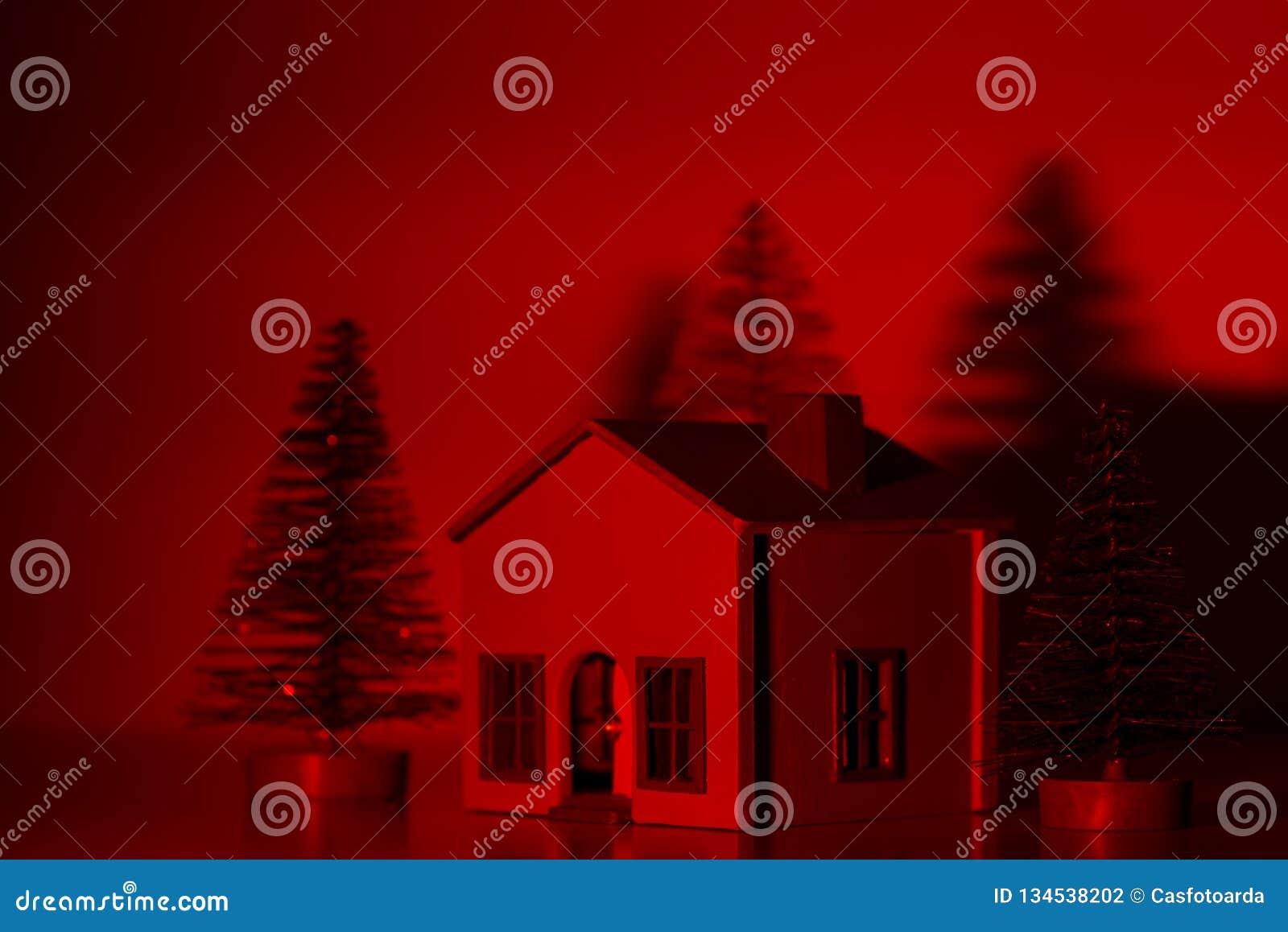 Colored with Red Light Handmade Small House with 3 Pine Trees. Stock ...
