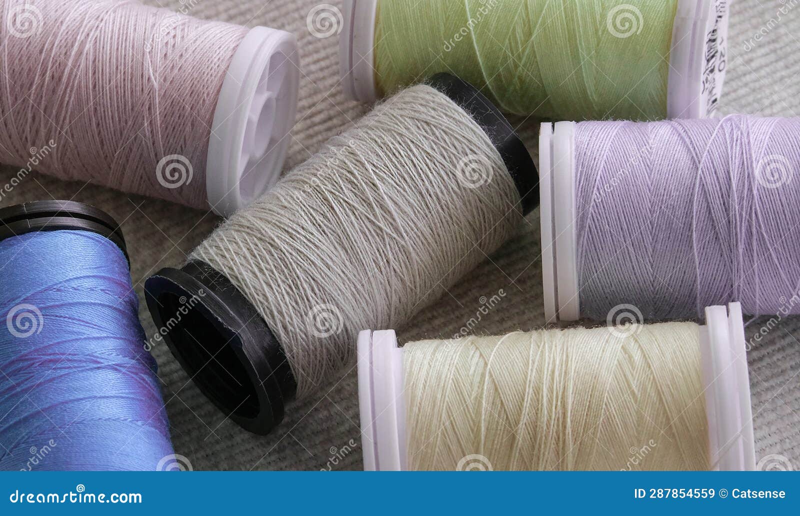Colored Sewing Thread Reels on Fabric Stock Image - Image of fiber ...