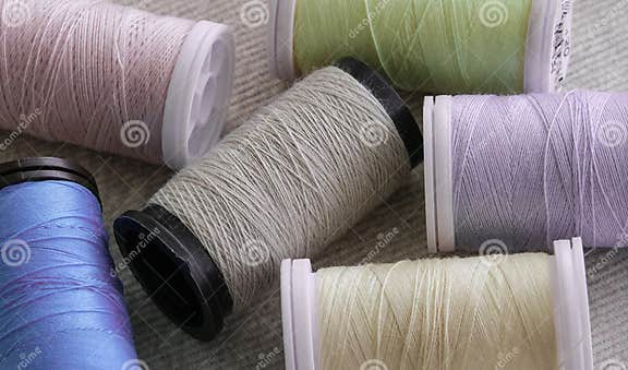 Colored Sewing Thread Reels on Fabric Stock Image - Image of fiber ...