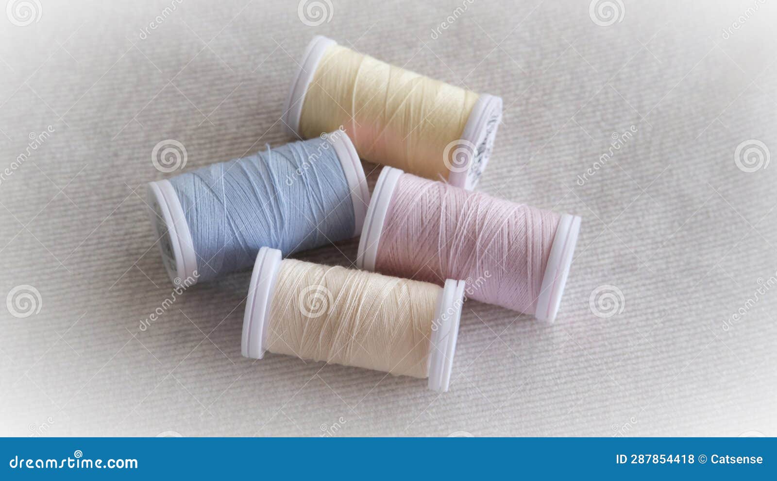 Colored Sewing Thread Reels on Fabric Stock Photo - Image of reel ...