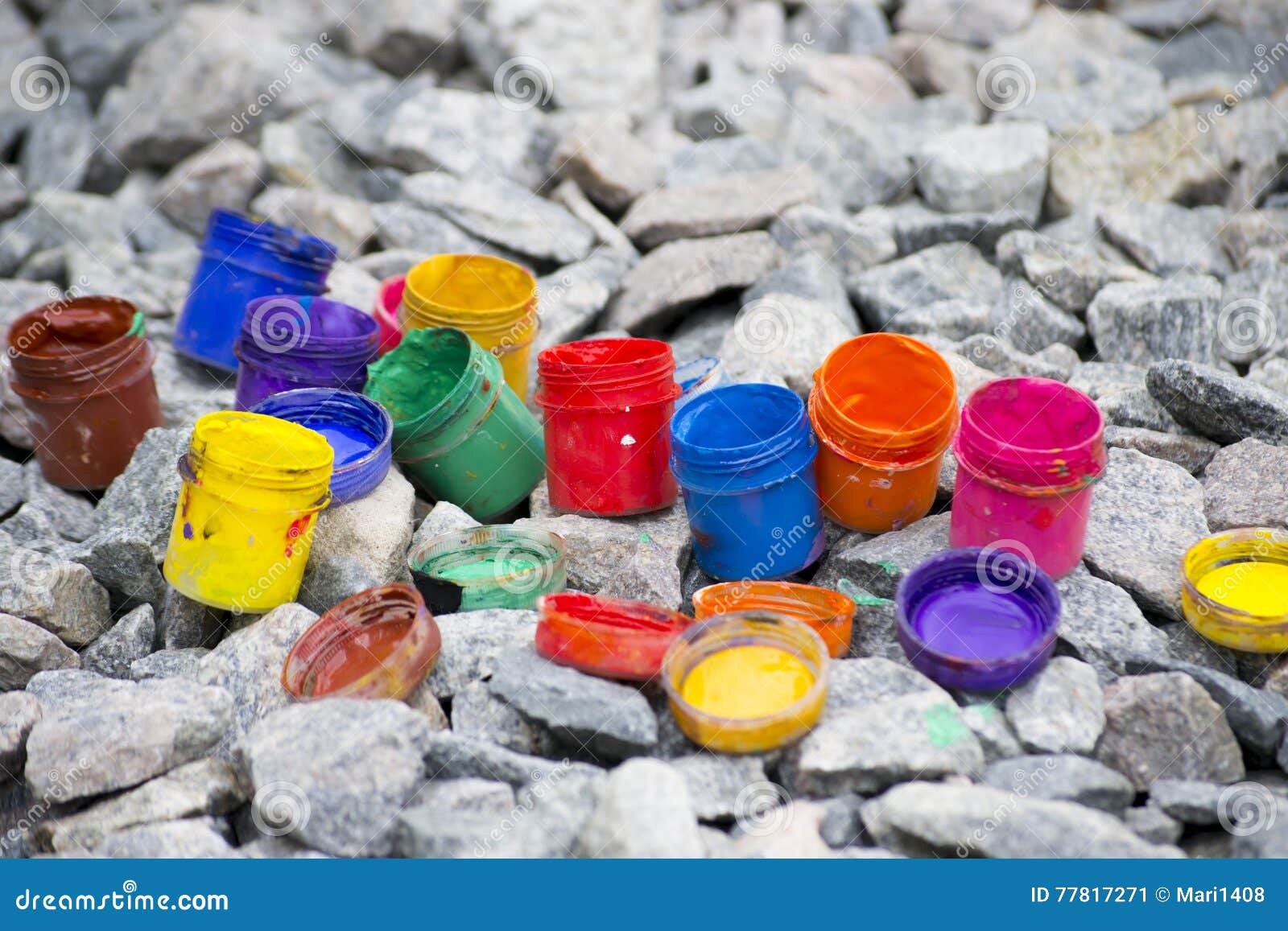 Colored Small Paint Cans Lie on a Gray Pebble Stock Image - Image of ...
