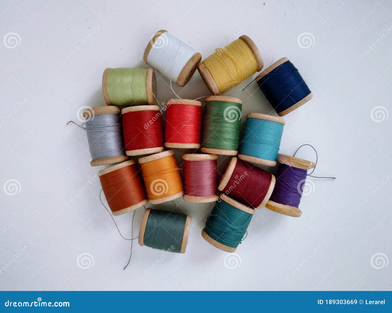 Colored Spools of Sewing Thread on a White Background Top View.Sewing ...