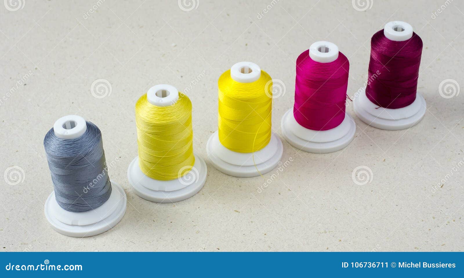 Colored spools of thread stock image. Image of beige - 106736711