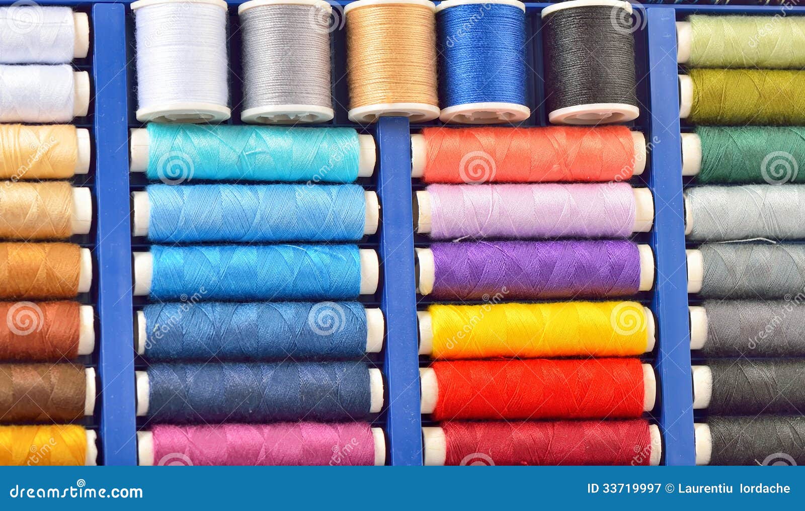Colored spools of threads stock image. Image of design - 33719997
