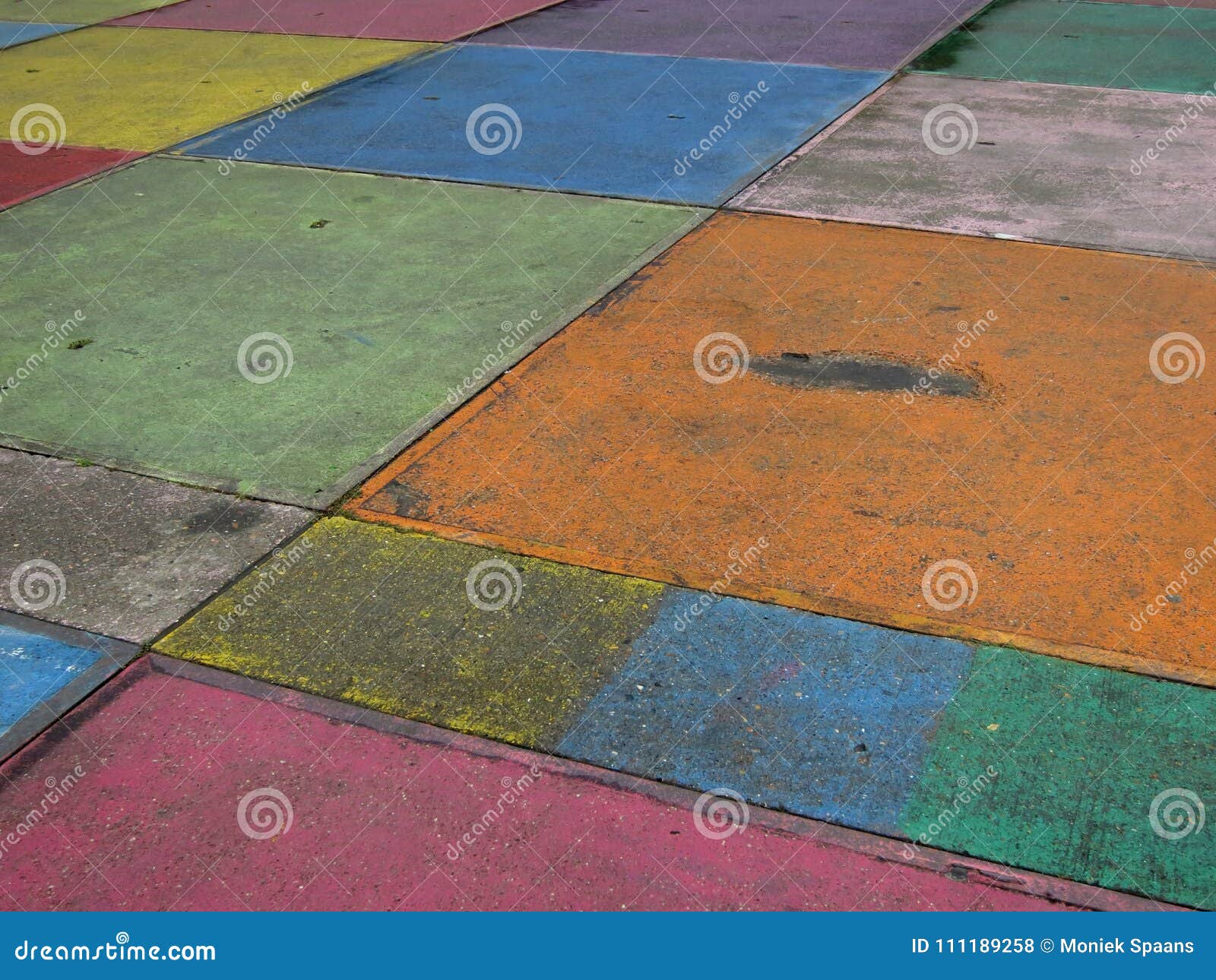 Multi Colored Field on Sidewalk Stock Photo - Image of orange, green ...