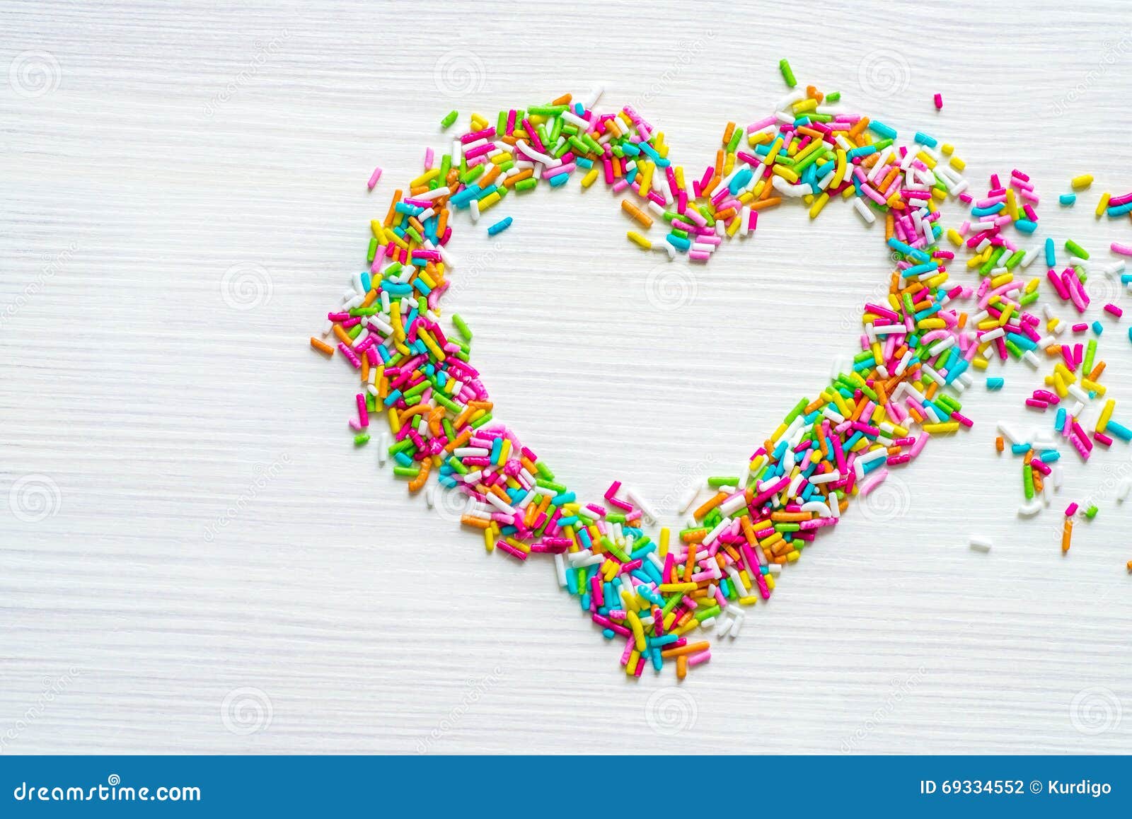 Colored Sugar Sprinkles in Heart Shape on White Wooden Table Stock ...