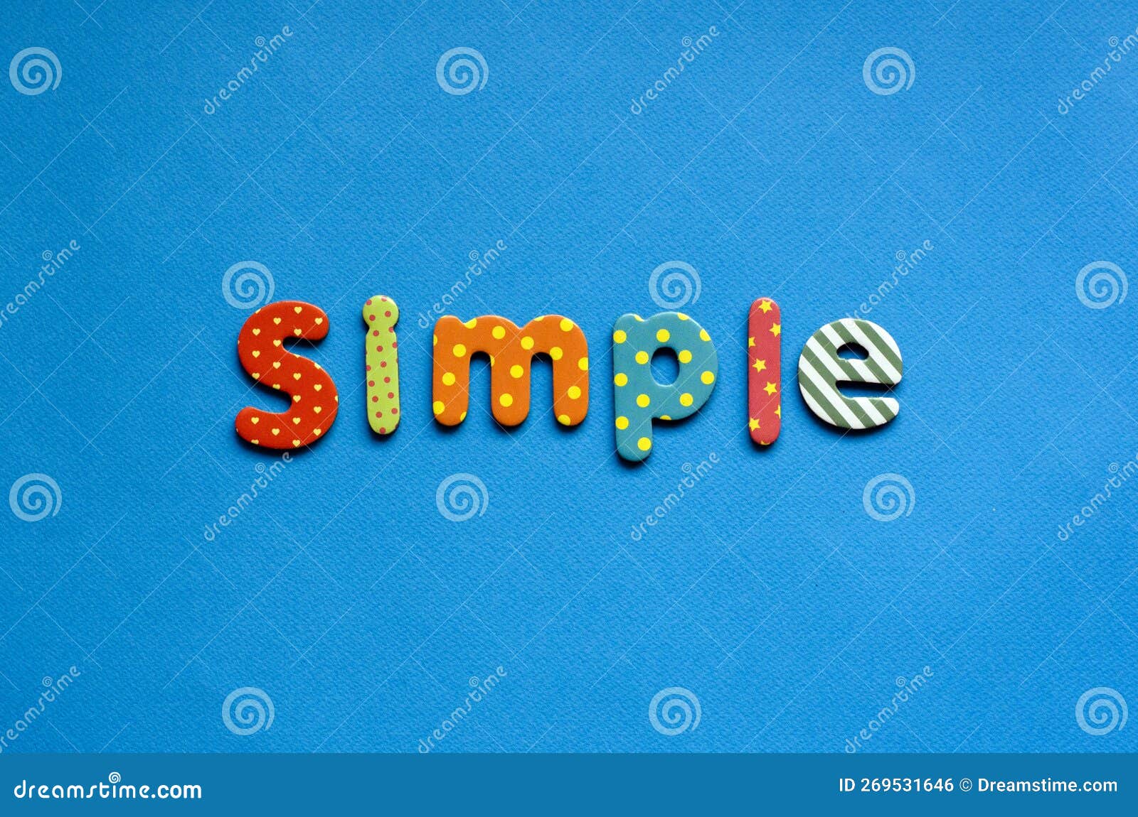 Colored Text Simple on Blue Paper Background. Stock Photo - Image of ...