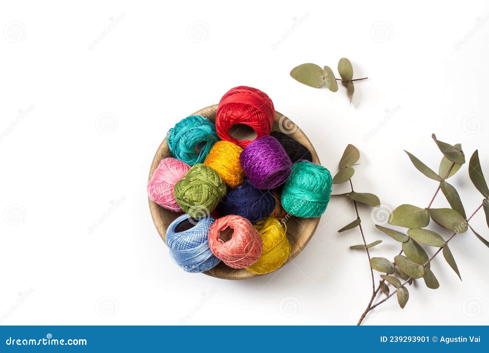 Colored Thread Spools in a Wooden Bowl on a White Background Stock ...