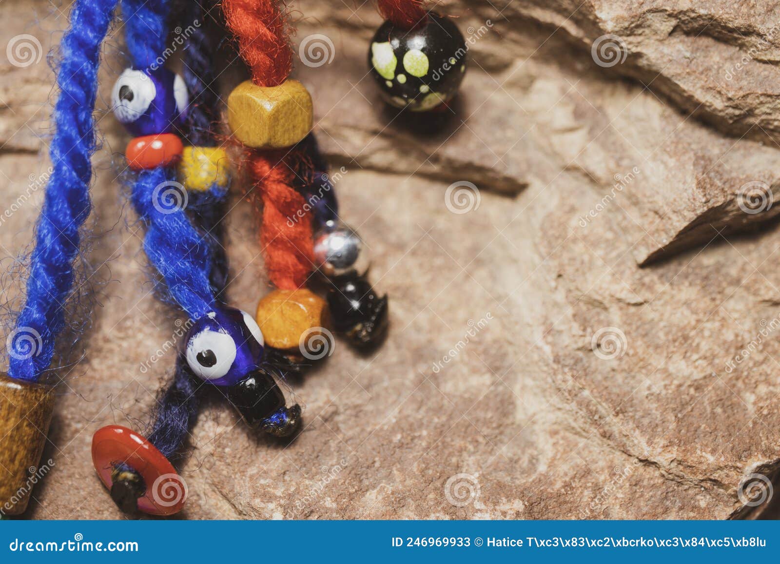 Colored Threads and Colored Beads at the Ends. Isolated on Stone ...