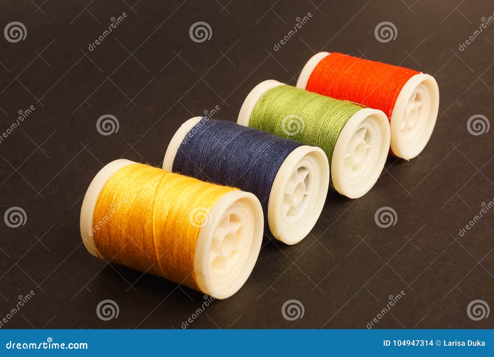 Red, Green, Yellow and Black Threads on Black Background, Stock Photo ...