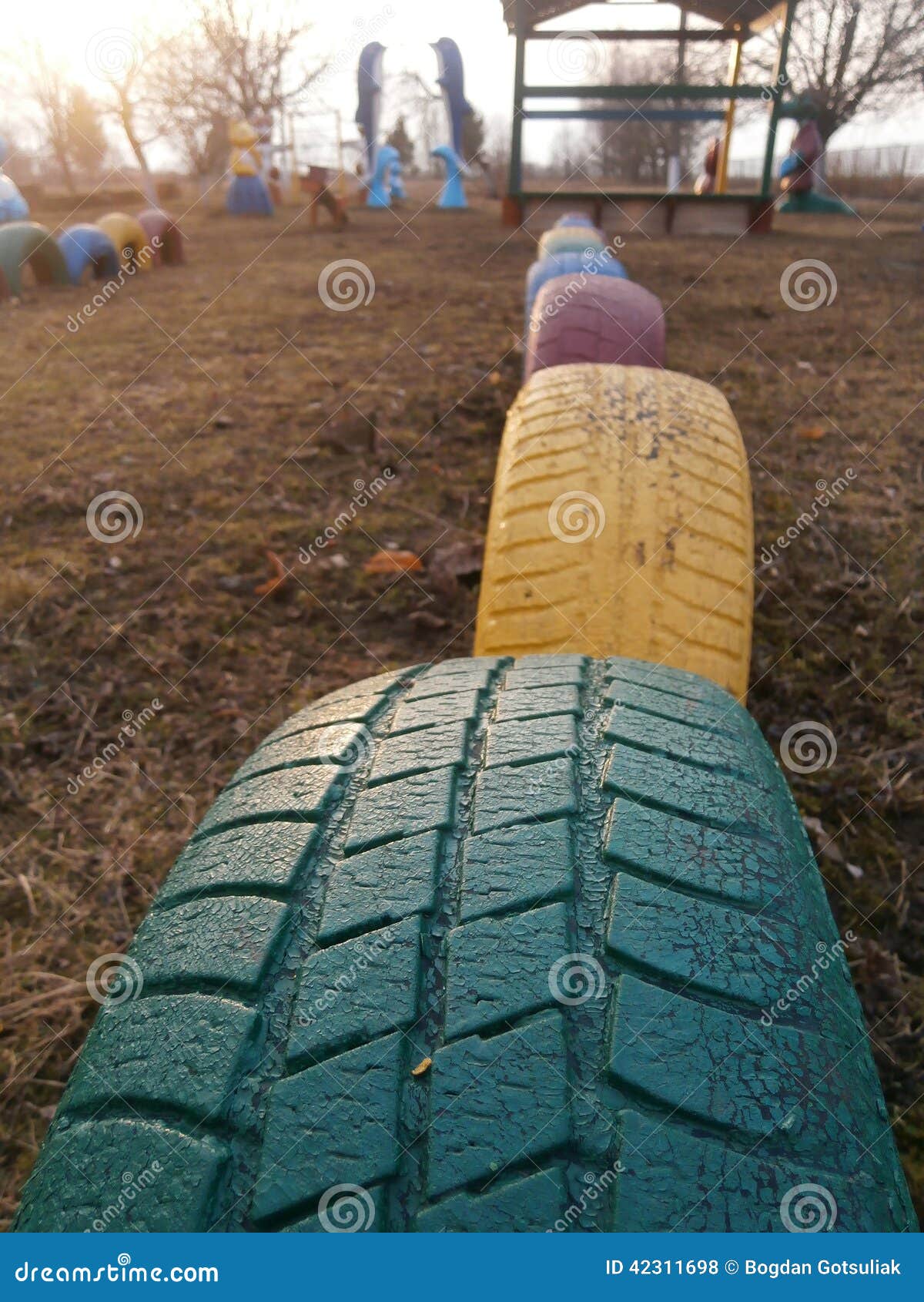 Colored tires stock photo. Image of buried, grass, area - 42311698