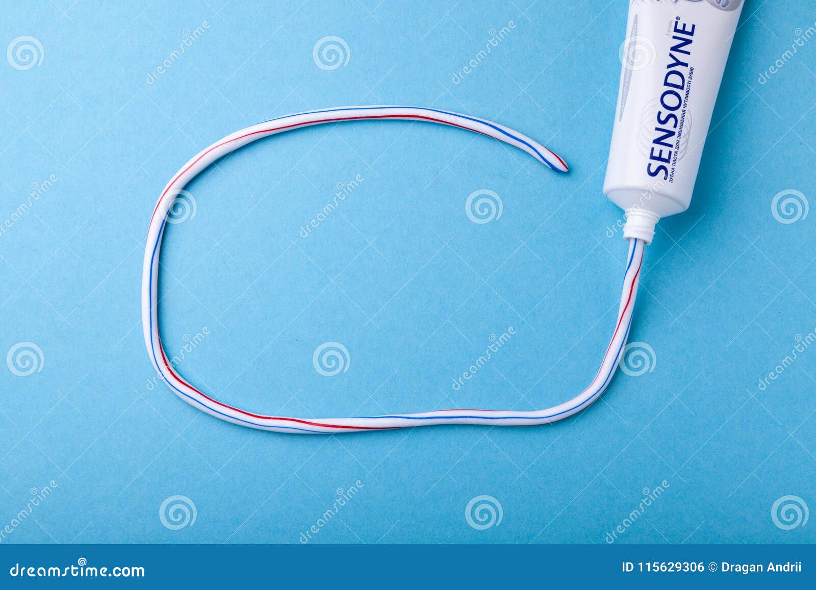 Colored Toothpaste Squeezed Out in Frame Shape from Tube on Blue Stock ...