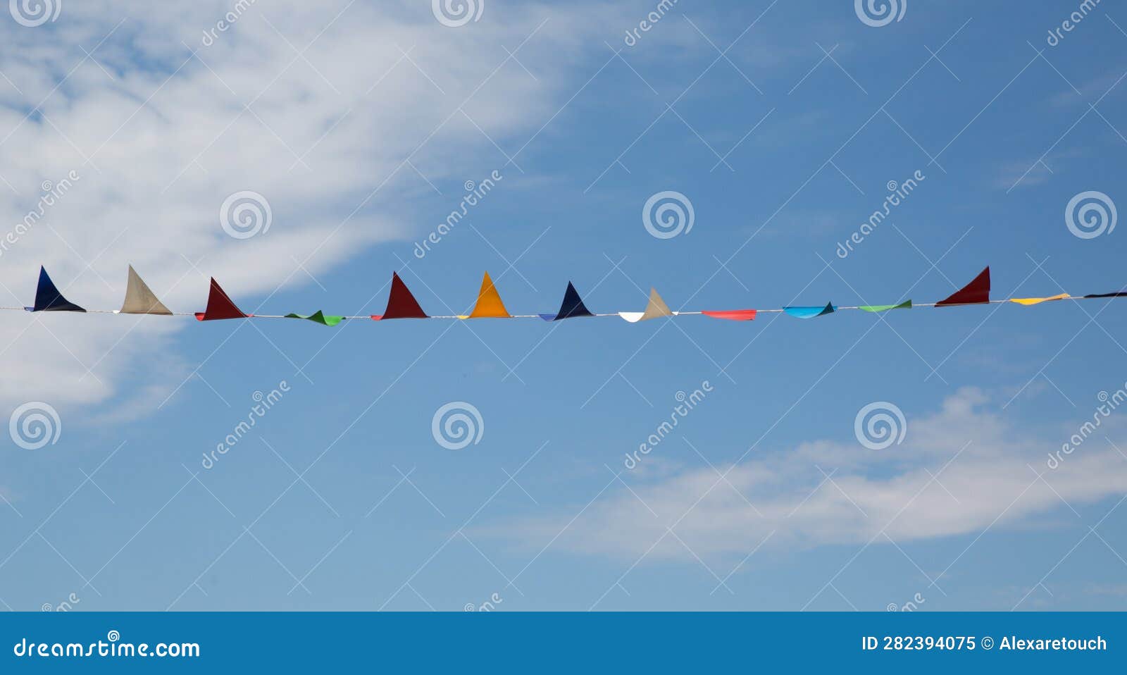 Colored Triangular Flags on Blue Sky Background Stock Image - Image of ...