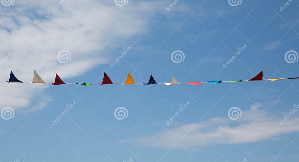 Colored Triangular Flags on Blue Sky Background Stock Image - Image of ...