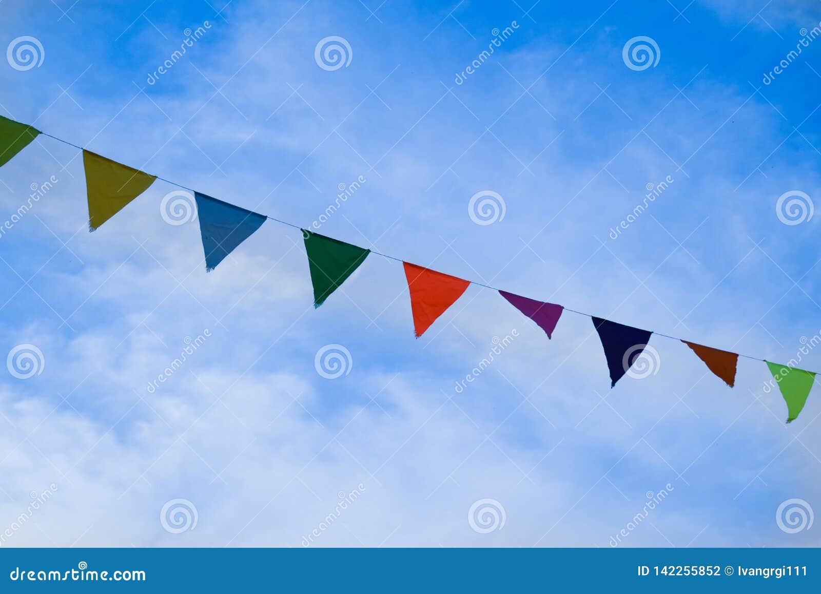 Colored Triangular Flags on Bright Blue Sky Background Stock Photo ...