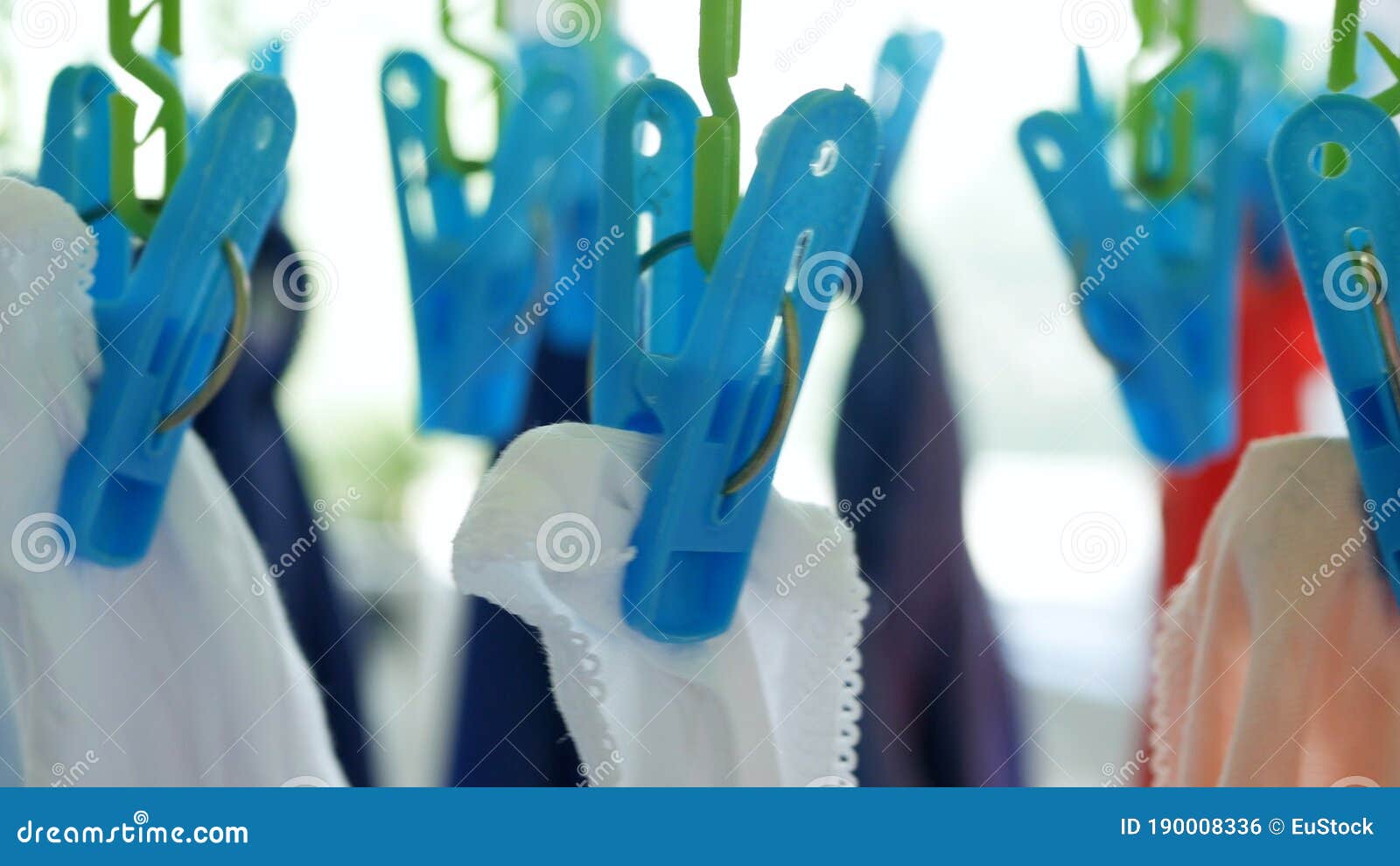 Colored Wet Clothes Cleaned with Laundry Machine Hanging To Dry Using ...