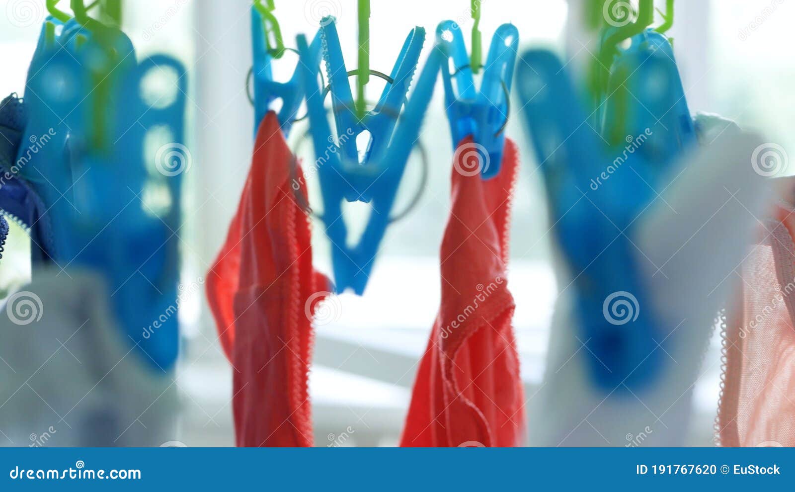 Colored Wet Clothes Cleaned with Laundry Machine Hanging To Dry Using ...