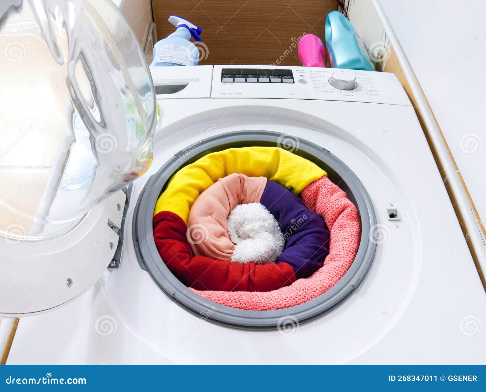 Colored Laundry in Washing Machine Cleaning Laundry Spinning Stock ...