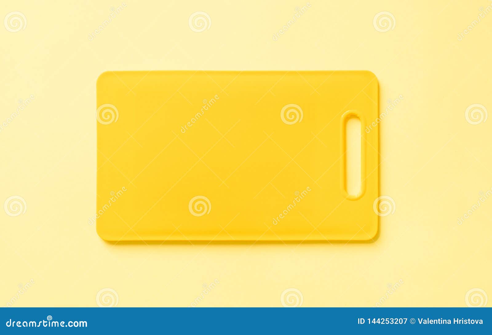 Colored Yellow Plastic Cutting Board on Yellow Background. Stock Image ...