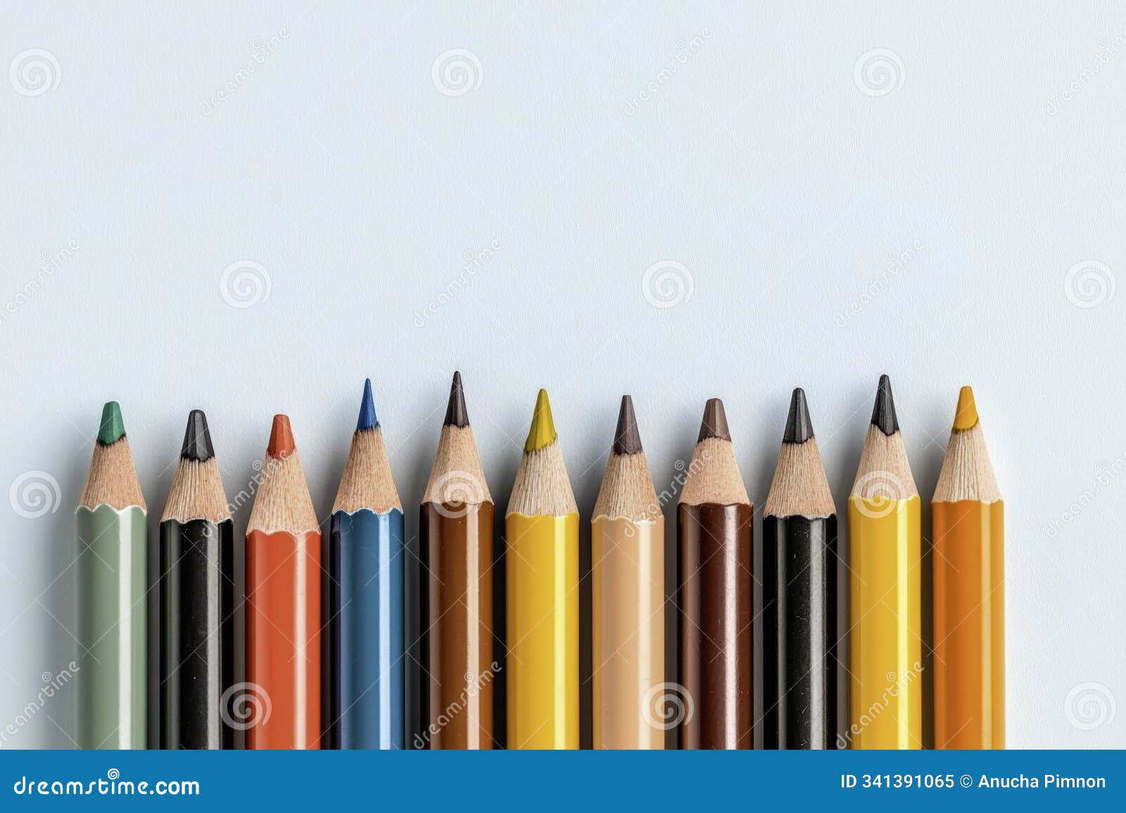 12 Sharpened Colored Pencils in Various Colors Arranged in a Row ...