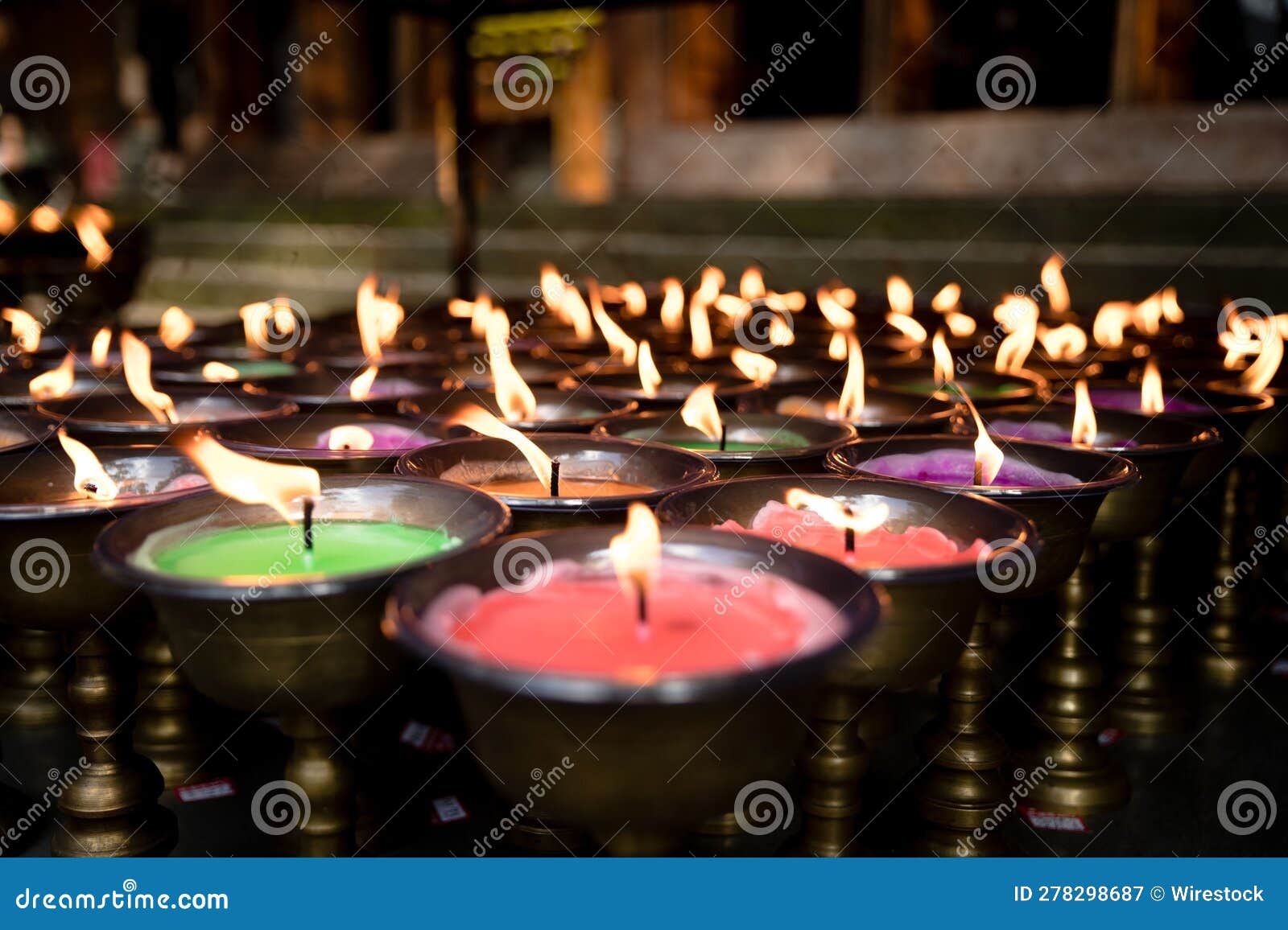 Colorful Array of Lit Candles Arranged in Rows, Creating a Visually ...