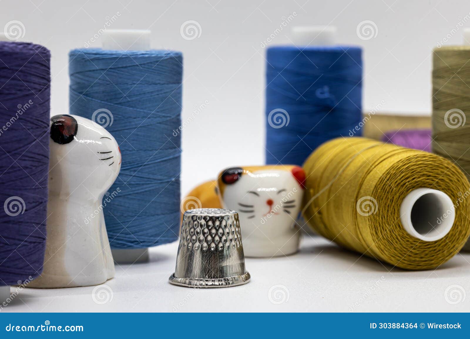 Several Different Spools of Thread Sit in a Pile on Top of Each Other ...