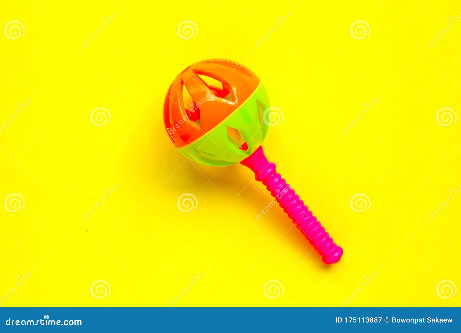 Colorful Baby Rattle on Yellow Background Stock Image - Image of ...