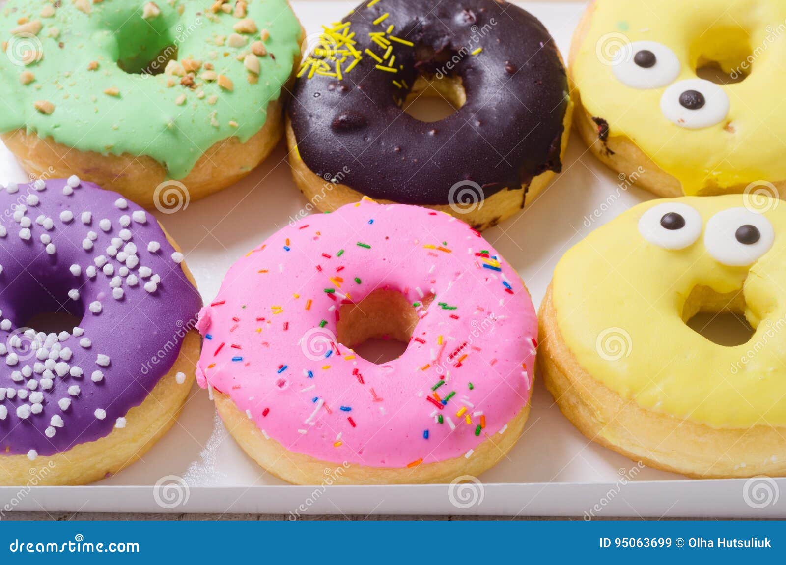 Colorful baked donuts stock image. Image of delicious - 95063699