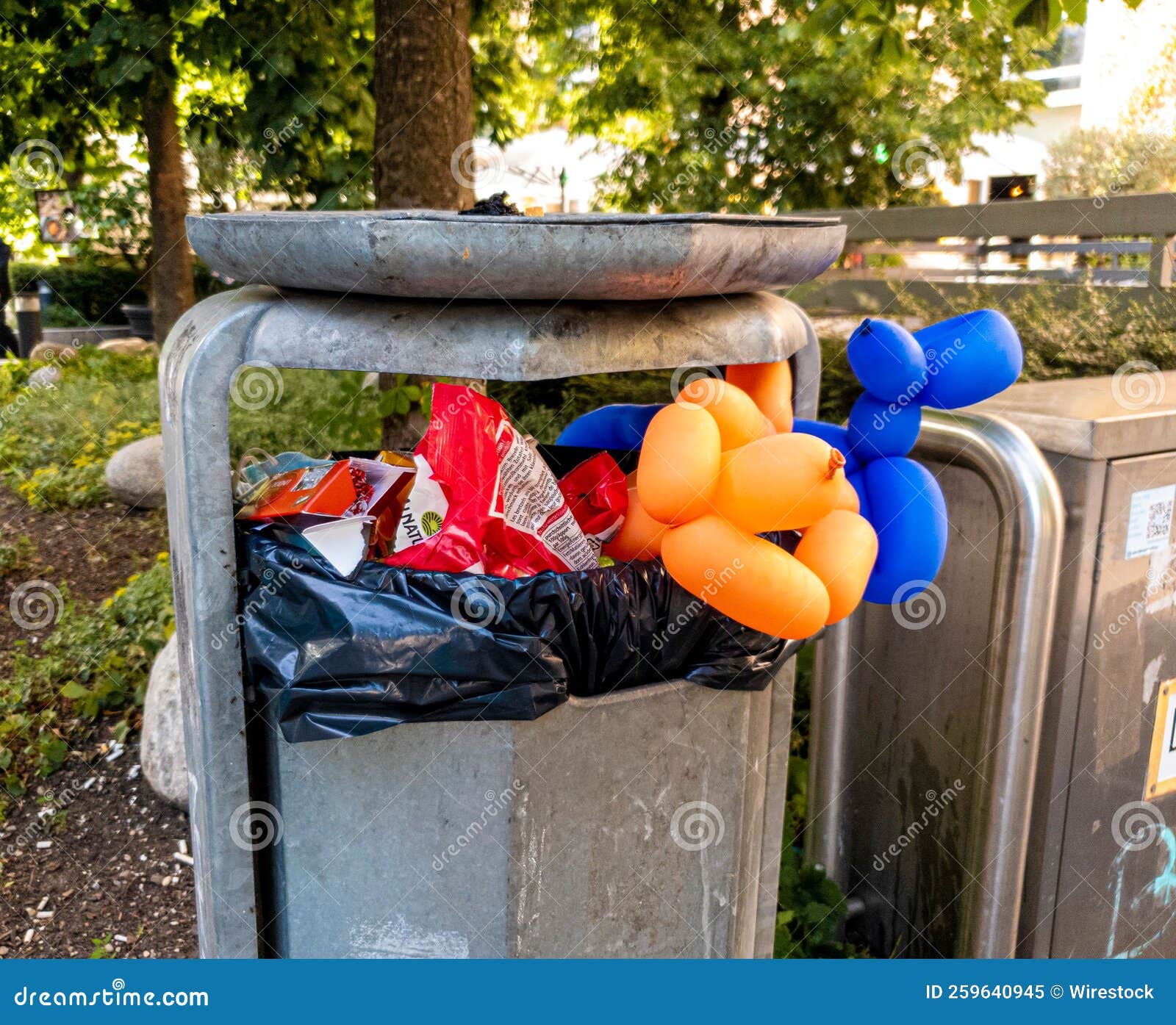 Colorful Balloon Dogs in the Trash Can in the Park Stock Image - Image ...
