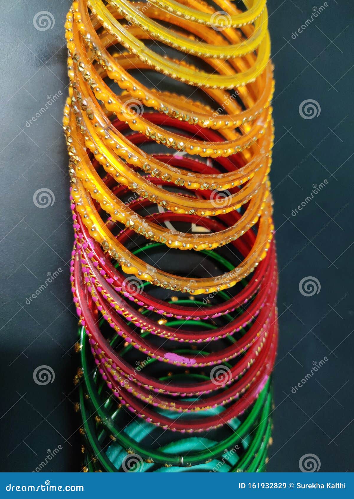 Colorful Bangles Arranged in a Pattern Stock Image - Image of green ...