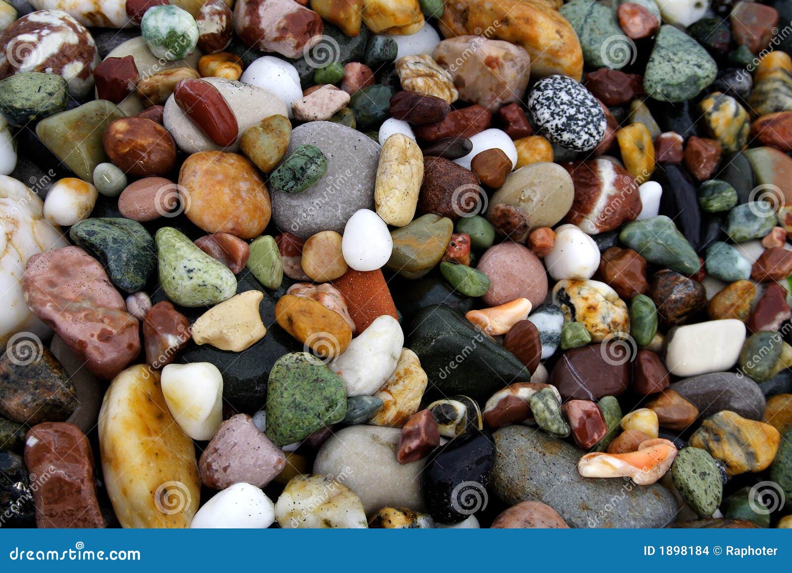 Colorful beach rocks stock photo. Image of smoothed, rocky - 1898184